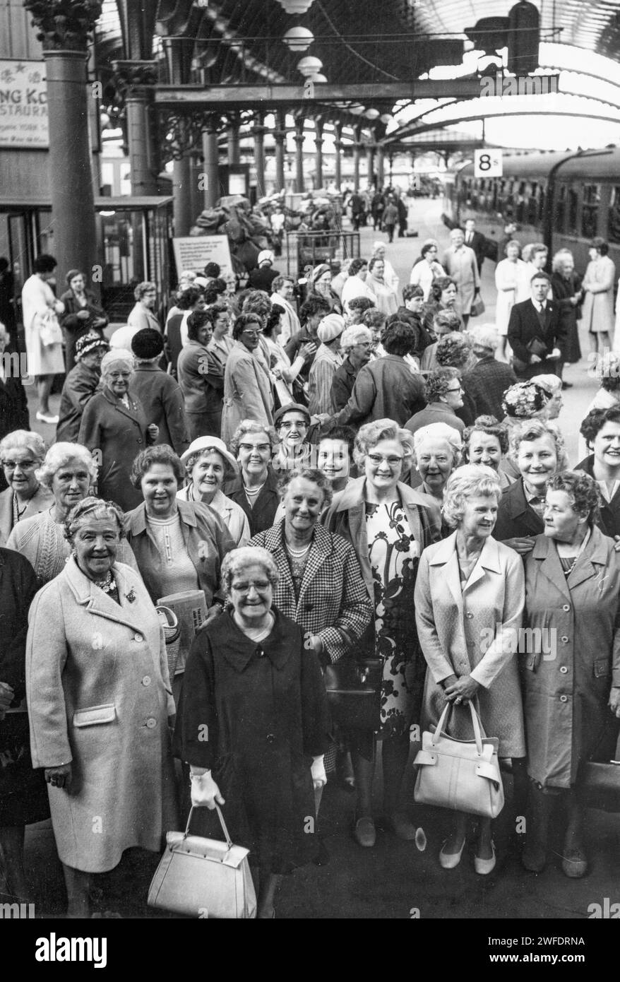 Group of pensioners going on a train journey 1960's Stock Photo - Alamy