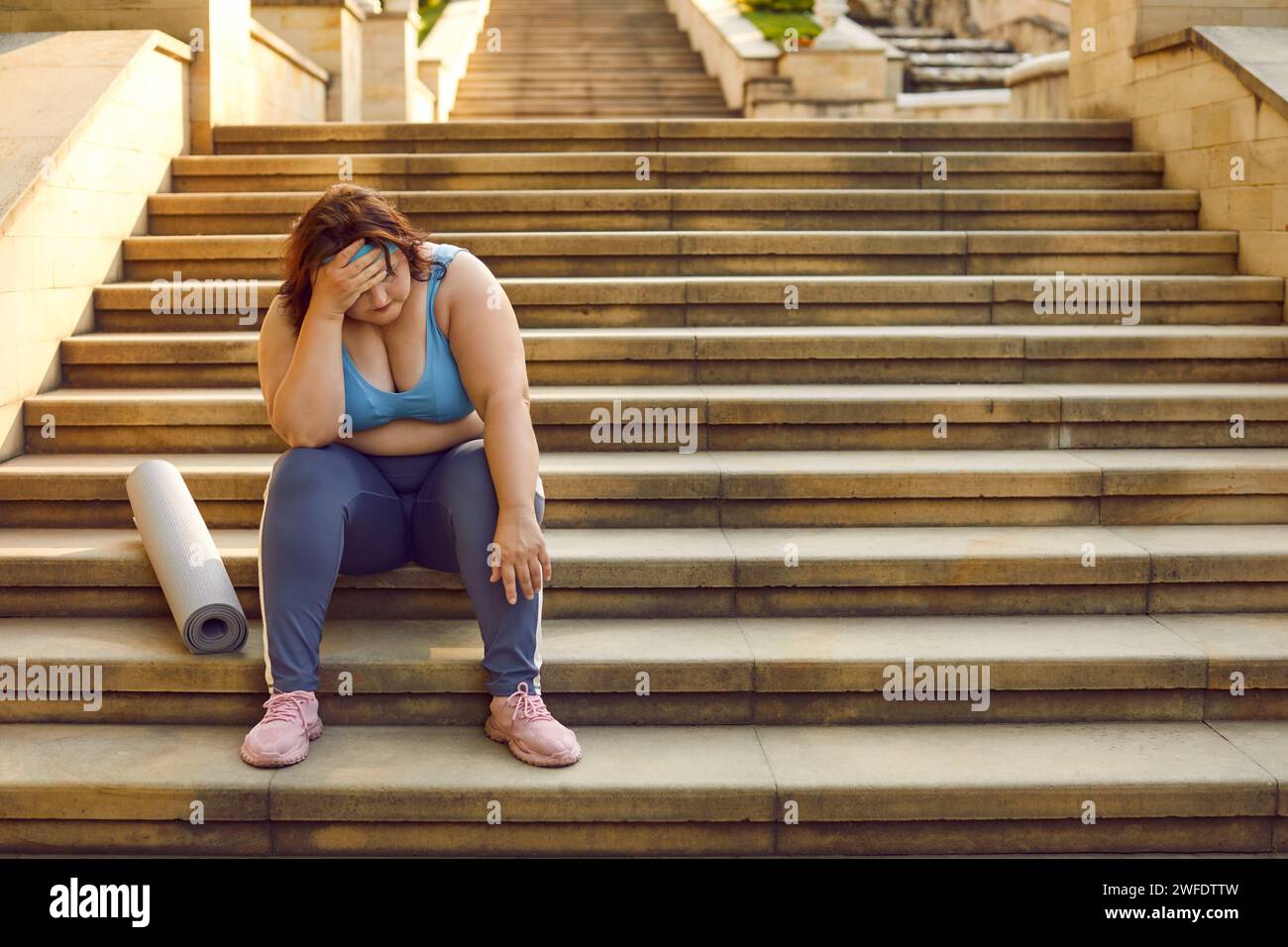 Woman fatigue stairs hi-res stock photography and images - Alamy