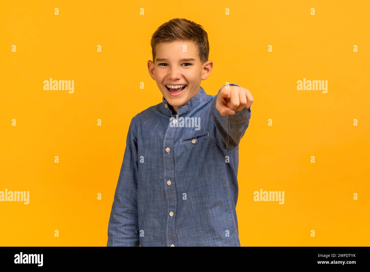 Gotcha. Positive Teen Boy Pointing Finger At Camera And Laughing Stock ...