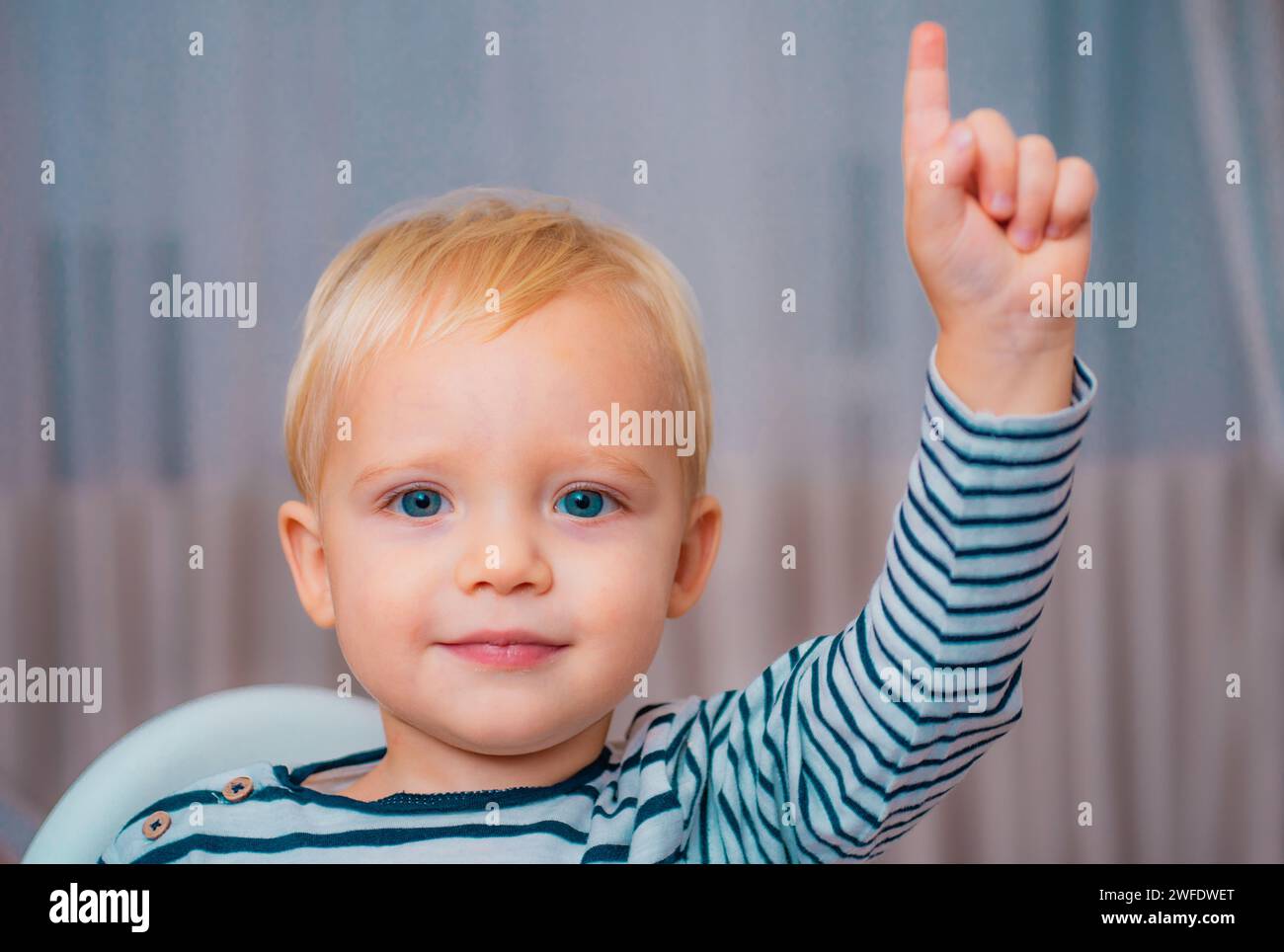 I have excellent idea. Boy cute toddler blue eyes pointing upwards ...