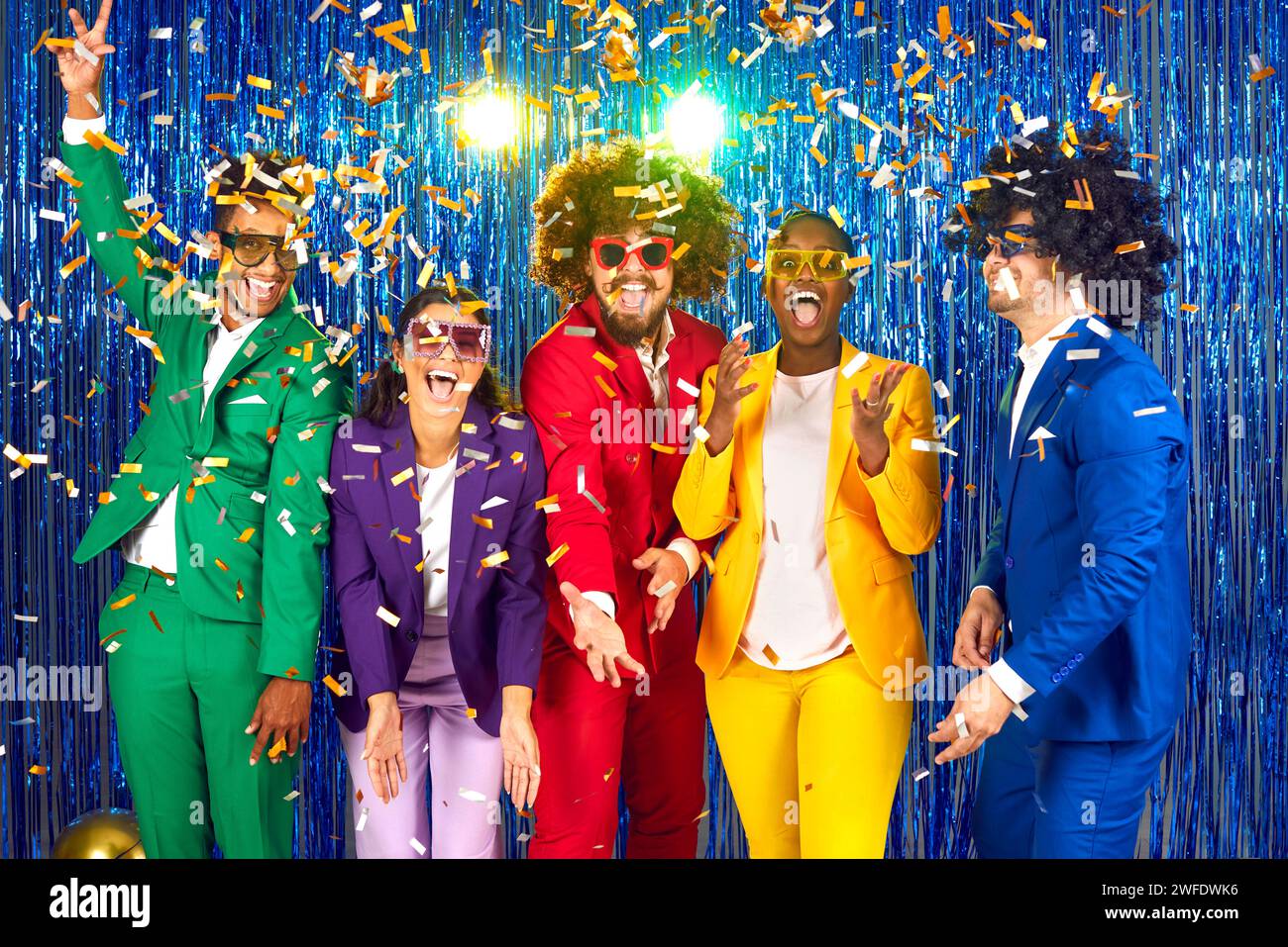 Funny group of happy young people dressed in bright business suits ...