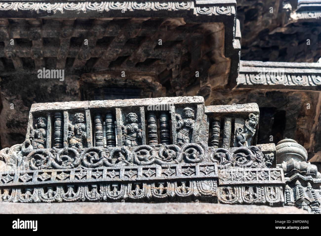 Beautiful intricate patterns and carvings of figurines on the wall of ...