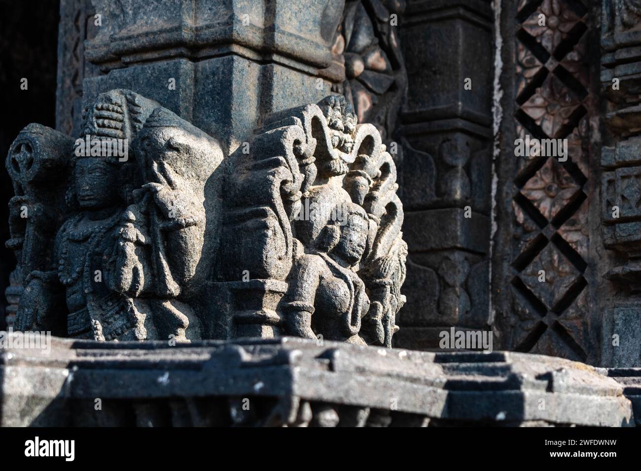 Stone sculpture of a Hindu deity at the ancient Hoysala era ...