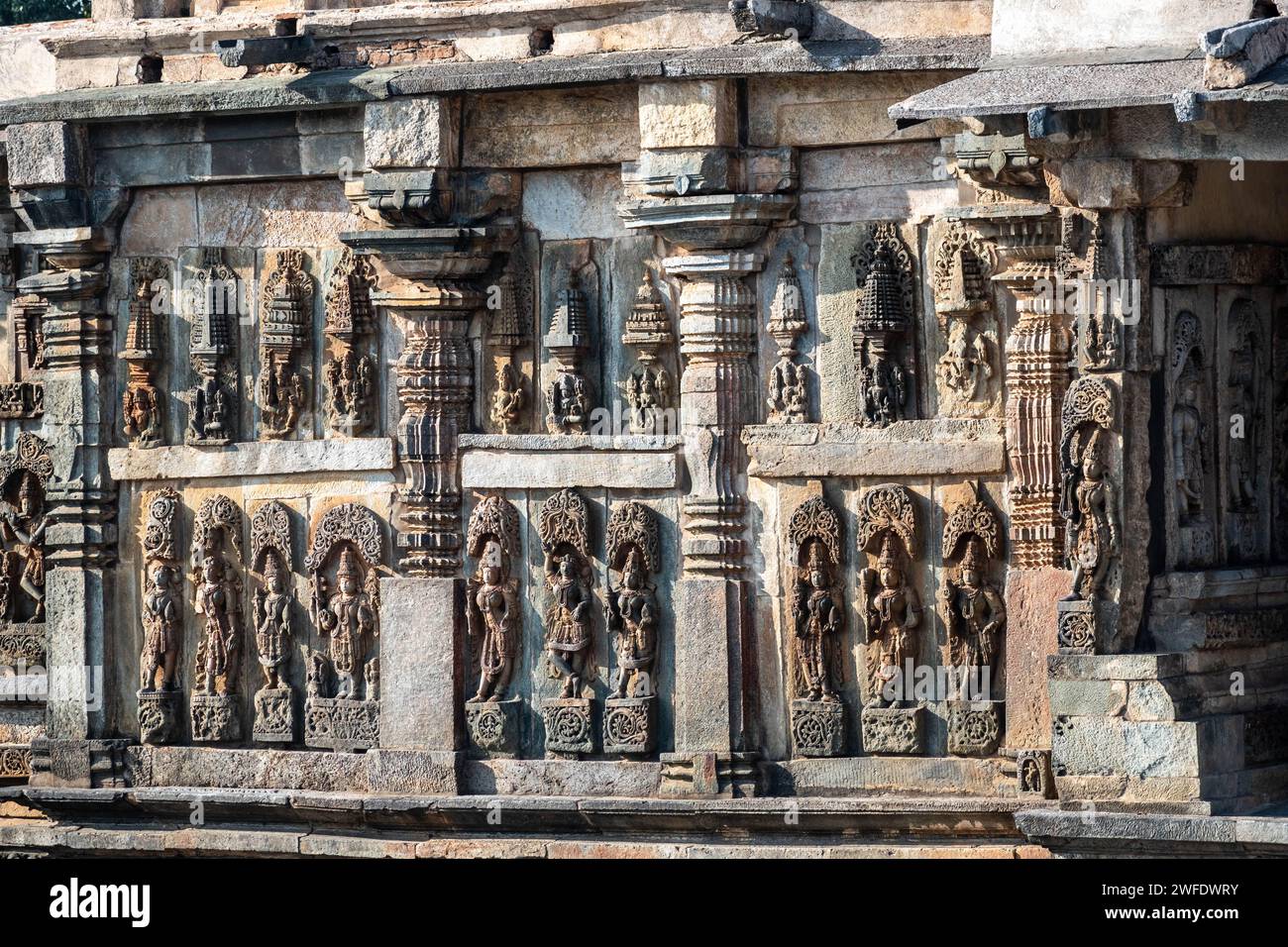 Beautiful intricate patterns and carvings of figurines on the wall of ...