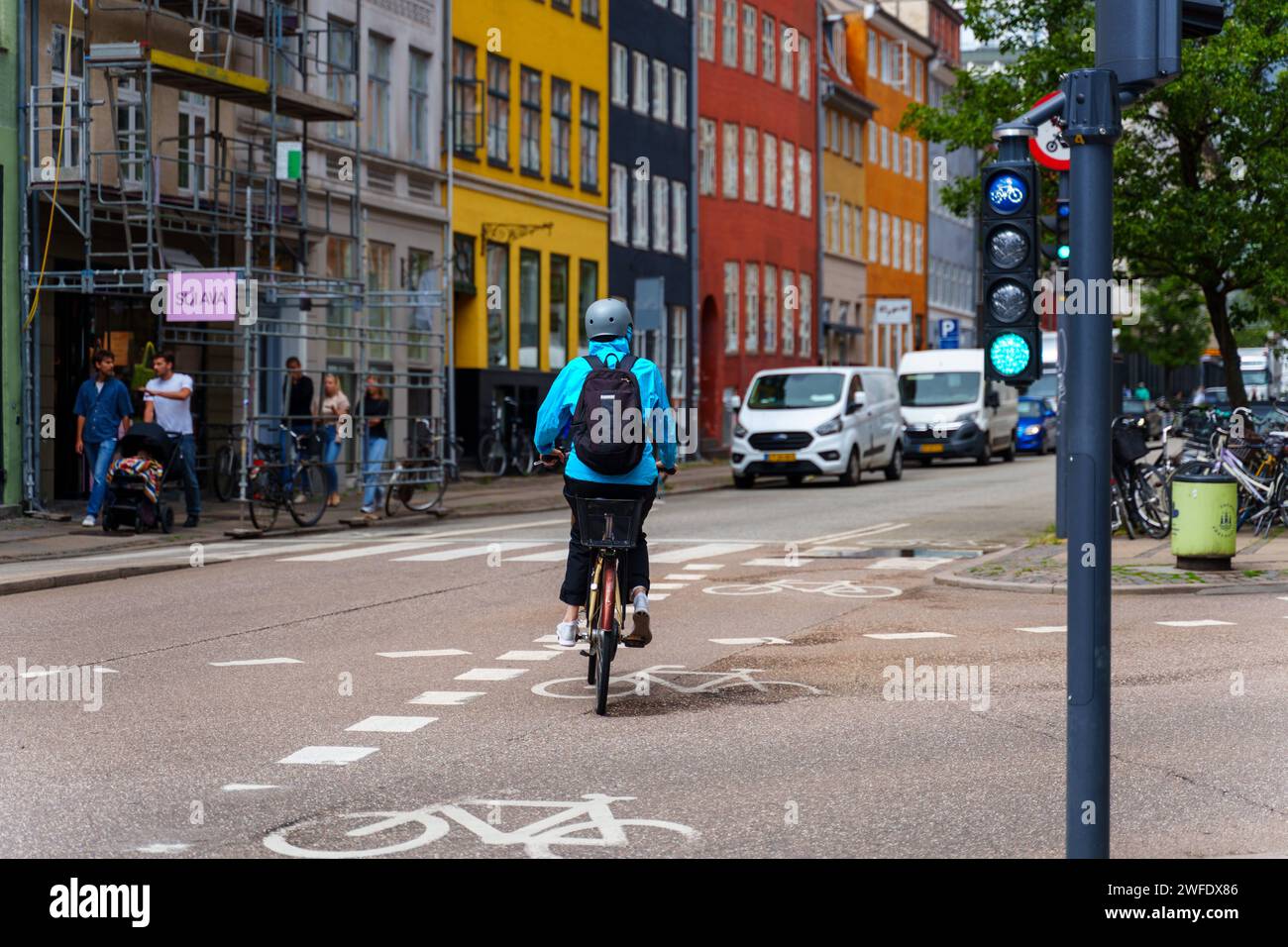 Copenhagen, Denmark - July 17, 2023: Woman riding a bicycle on a cycle ...