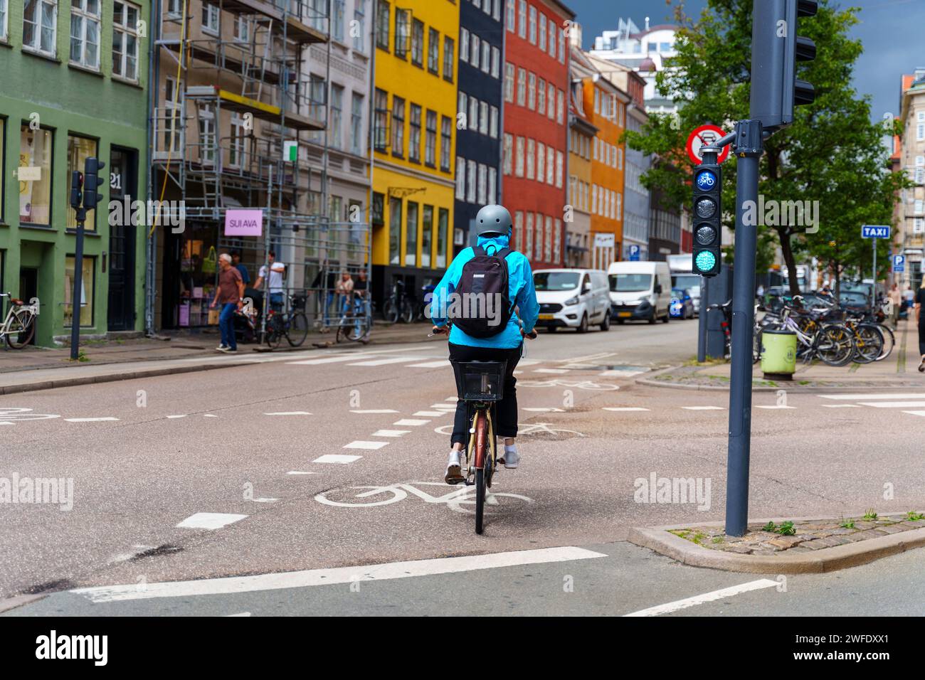 Copenhagen, Denmark - July 17, 2023: Woman riding a bicycle on a cycle ...