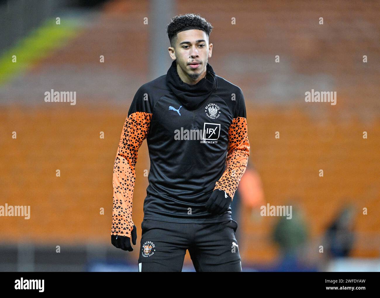 Jordan Lawrence-Gabriel of Blackpool warms up ahead of the match ...
