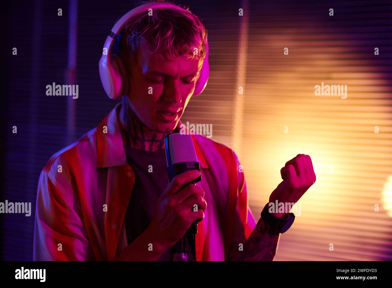 Portrait of emotional singer performing in night club Stock Photo - Alamy