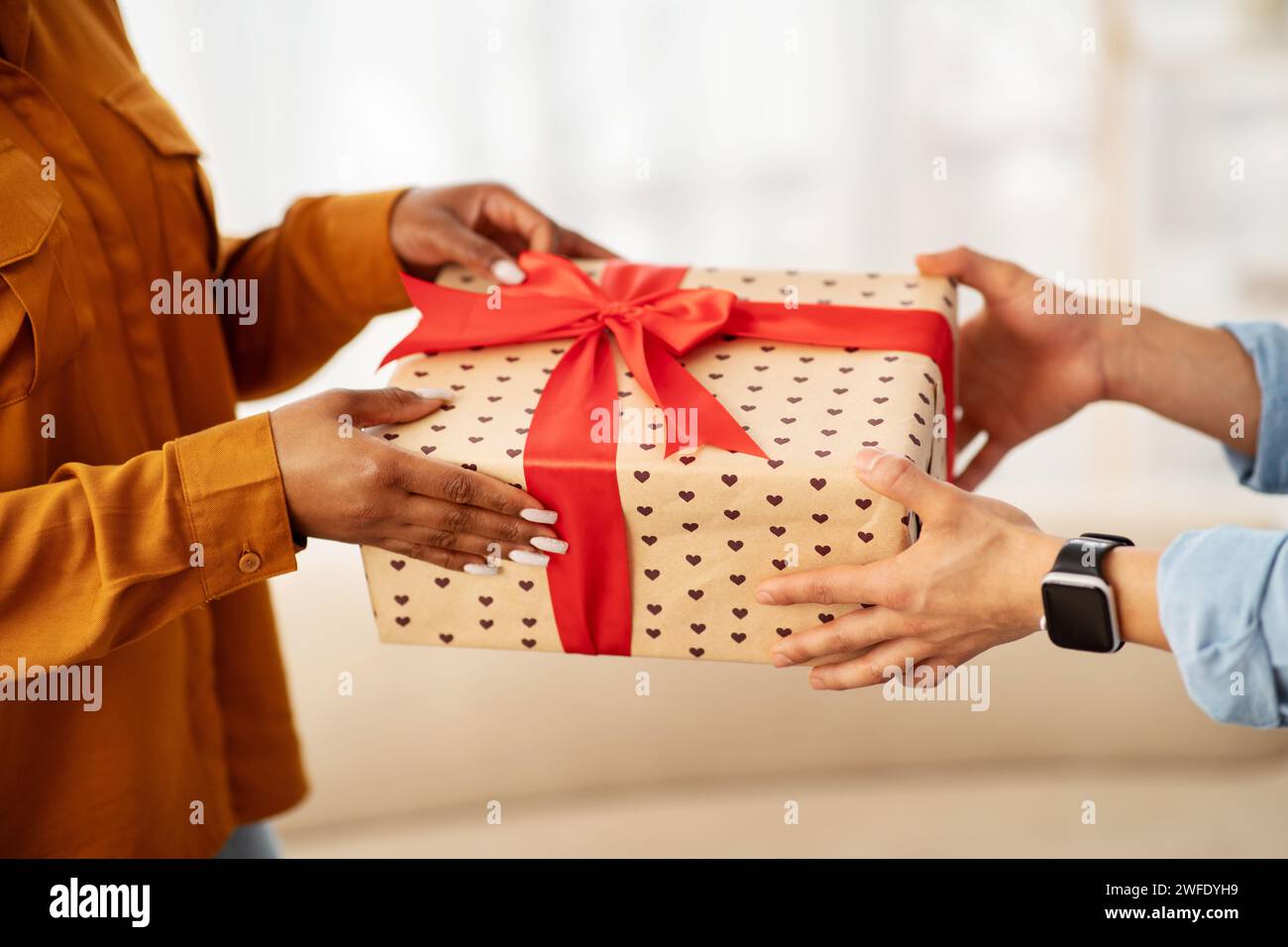 Two individuals share a special moment while exchanging a beautifully ...