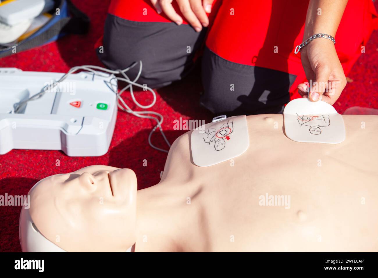 First aid and CPR training using automated external defibrillator device - AED Stock Photo - Alamy