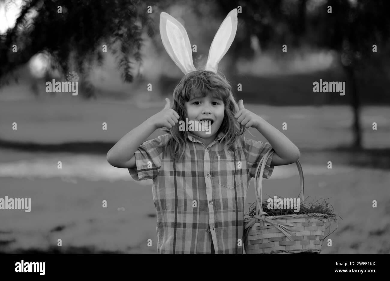 Happy Easter. Kids boy hunting easter eggs. Child in bunny ears hunt ...
