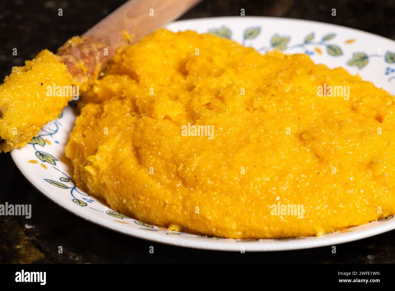 Polenta on plate ready to serve. A traditional cornmeal food Stock ...