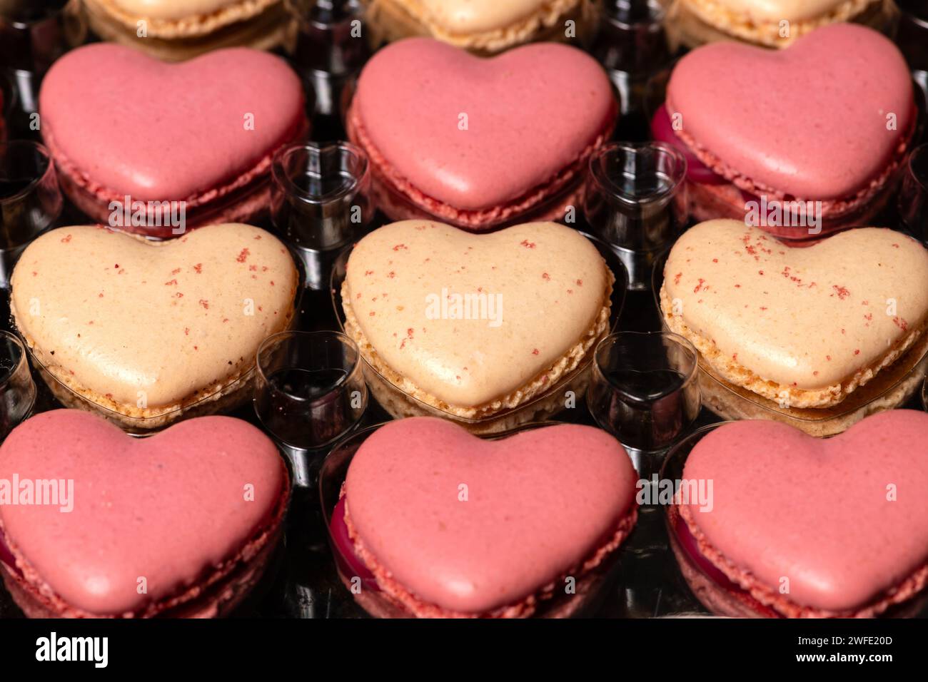 Traditional french baked pastry, heart shaped macarons with vanilla and ...