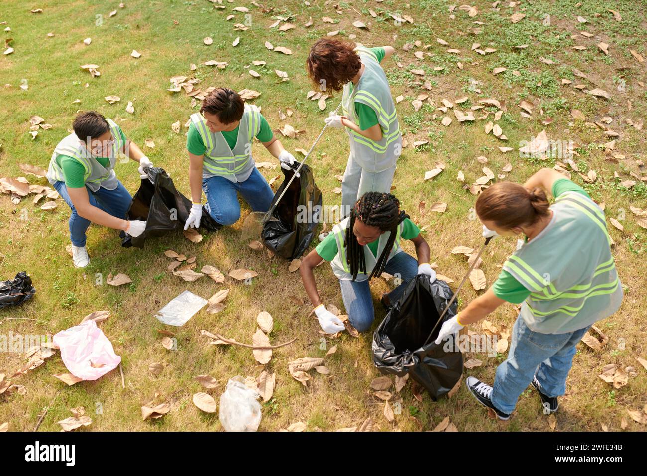 Group of eco volunteers collecting garbage on college campus Stock ...