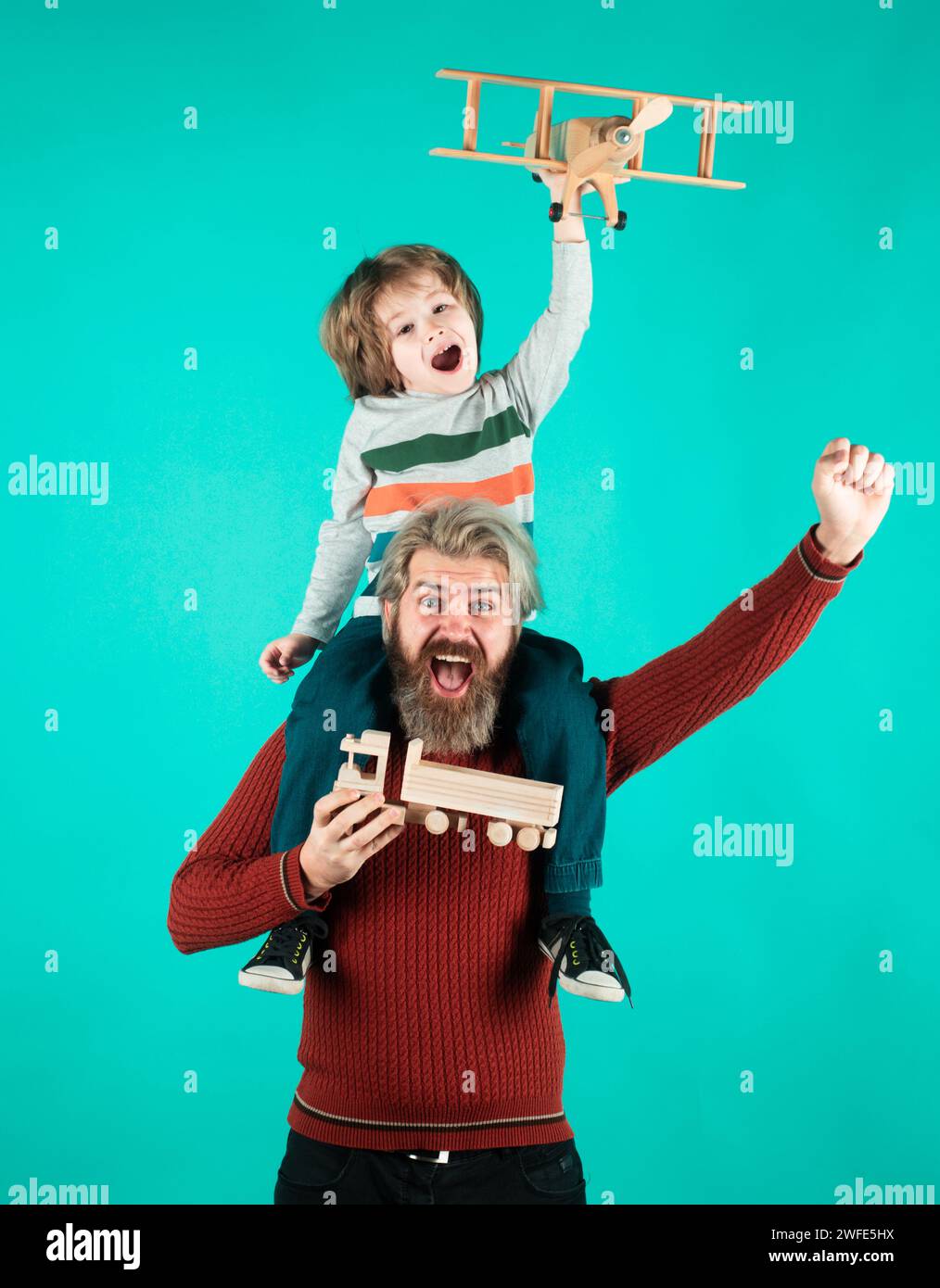 Father and son. Child pilot aviator with airplane dreams of traveling ...