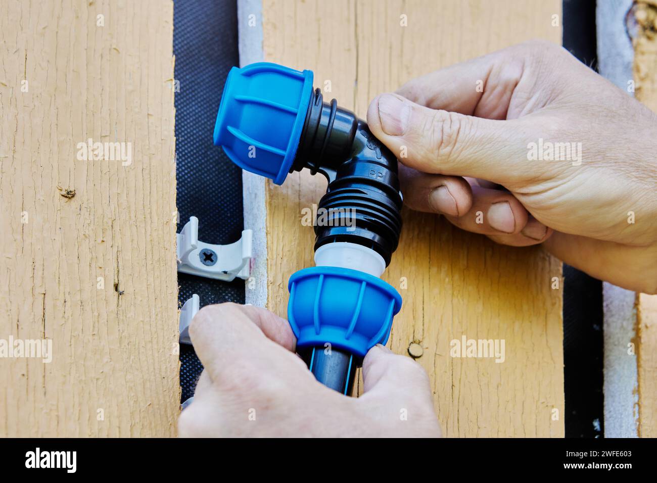 Compression clamping elbow for external water supply Stock Photo - Alamy