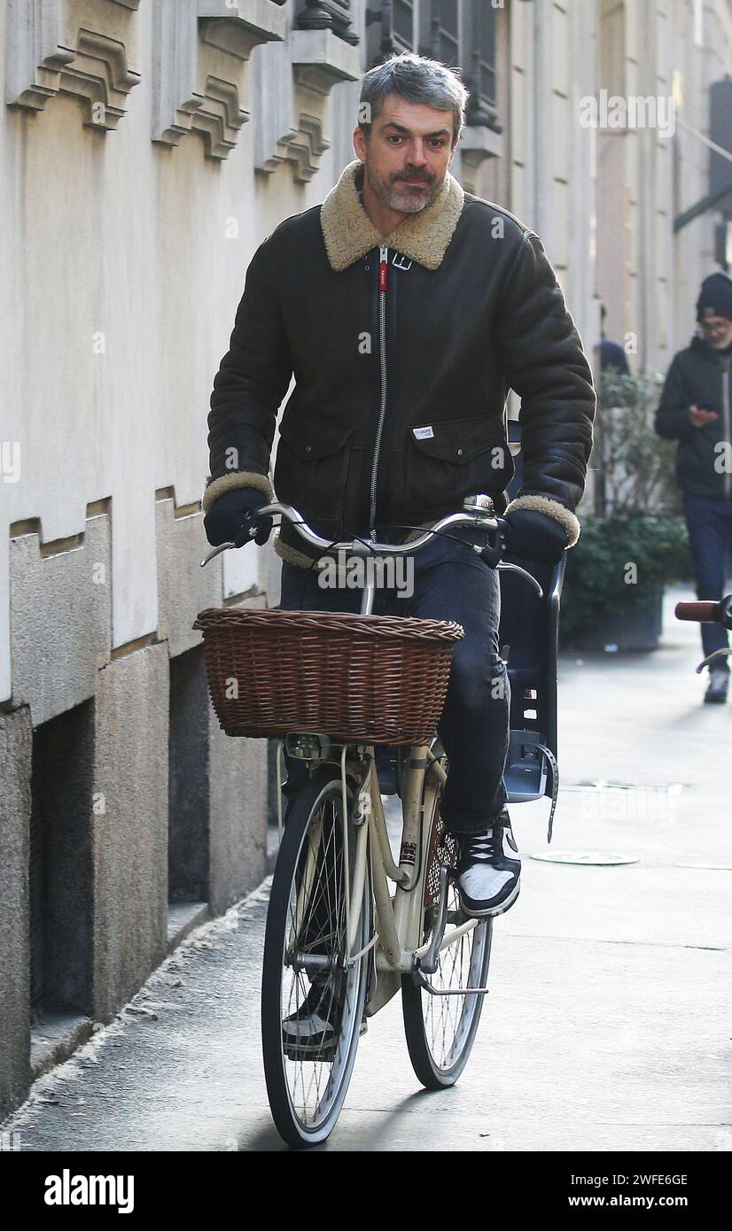 Milan, It. 30th Jan, 2024. Luca Argentero riding his bicycle in the ...