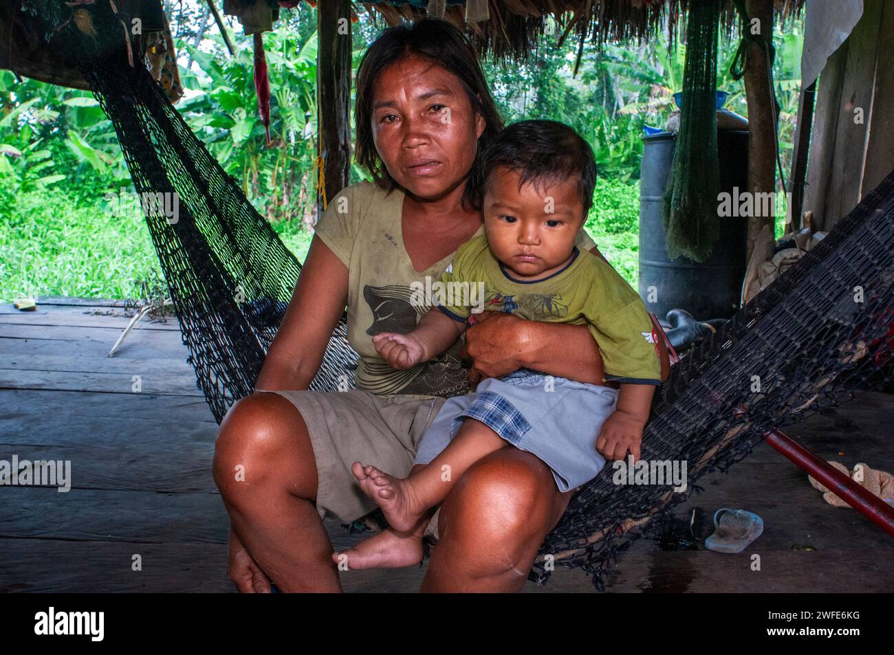 Local family in the riverside village of Timicuro I. Iqutios peruvian ...