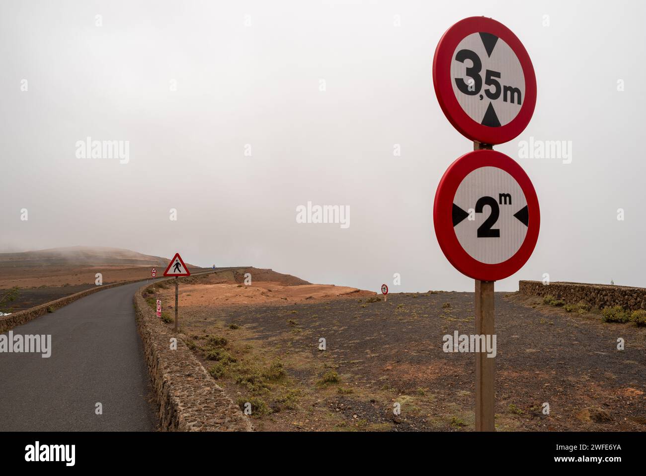 Traffic signs at Mirador del Rio in the fog, Lanzarote, Spain Stock ...