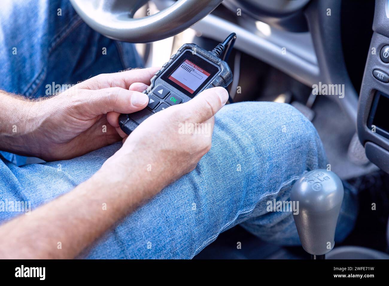Using diagnostic car code reader to erase error codes Stock Photo - Alamy