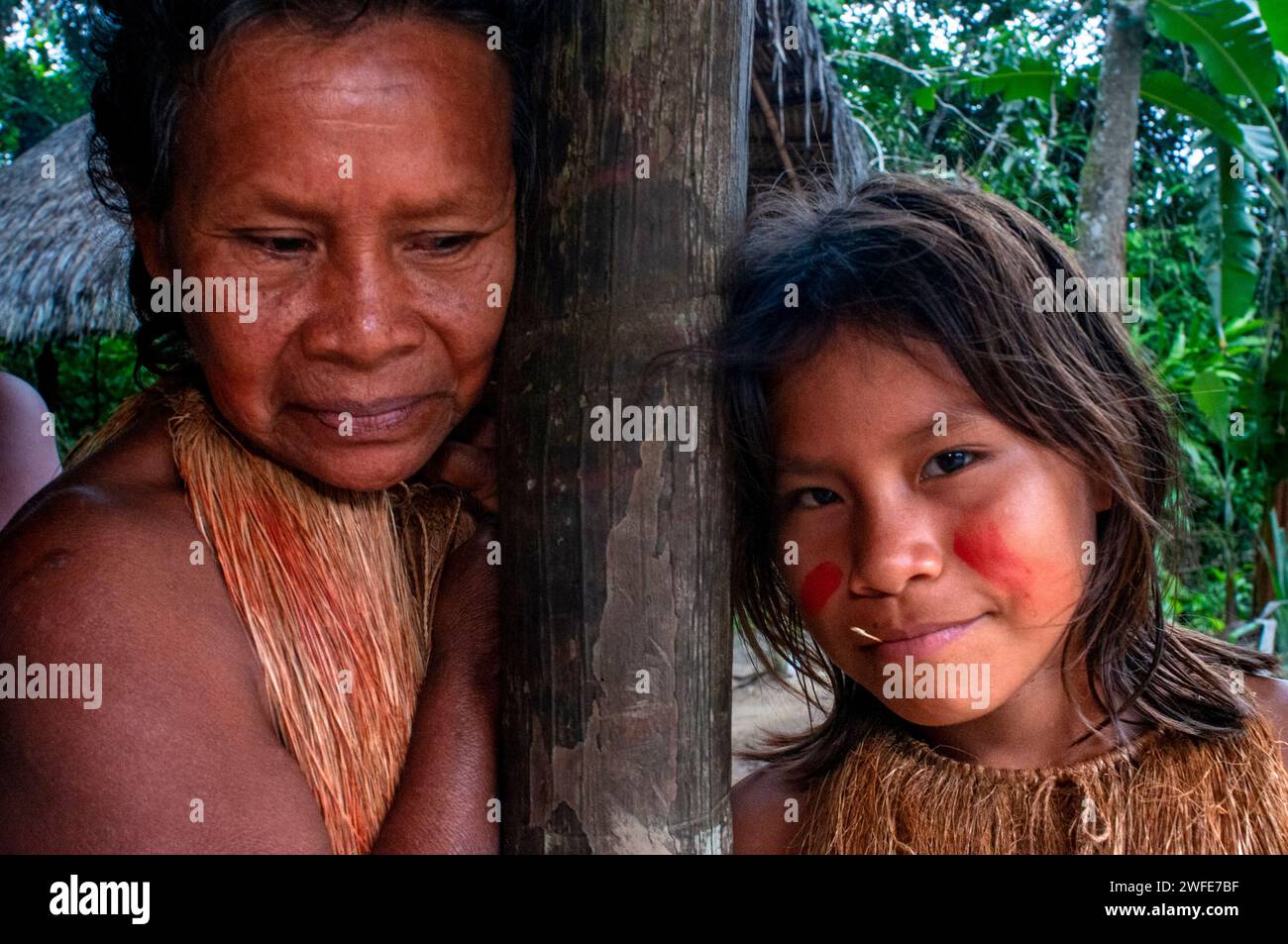 Grandmother And Granddaughter Yagua Indians Living A Traditional Life