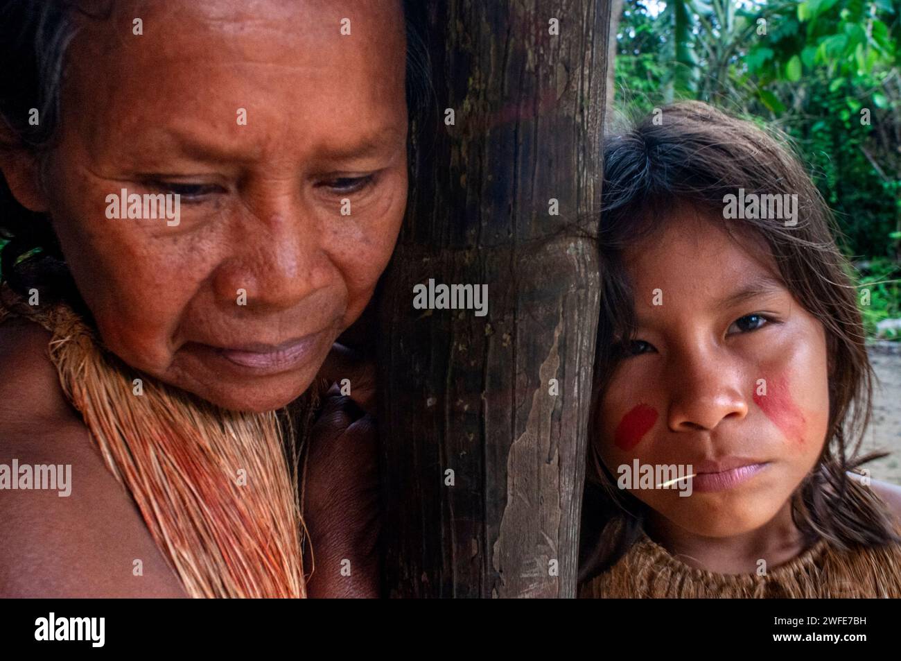 Grandmother And Granddaughter Yagua Indians Living A Traditional Life