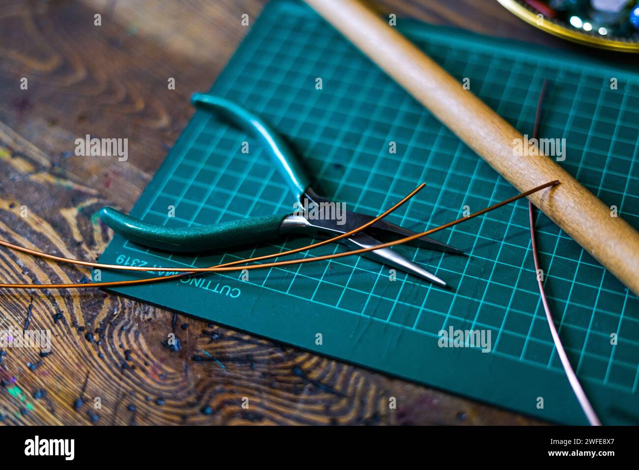 Green pliers on the table. Useful tool in the lab Stock Photo - Alamy