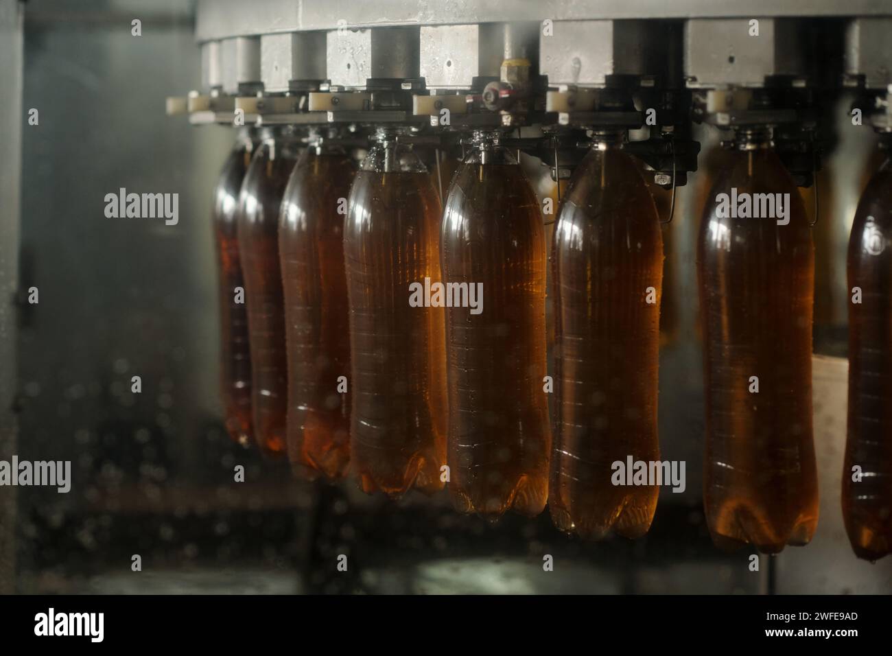 Plastic bottles moving along conveyor hi-res stock photography and ...