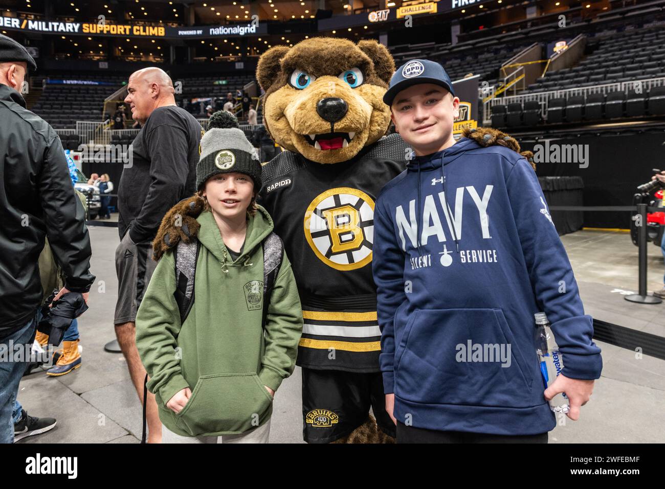 Bruins mascot Blades posing with two young boys at the Boston Bruins ...