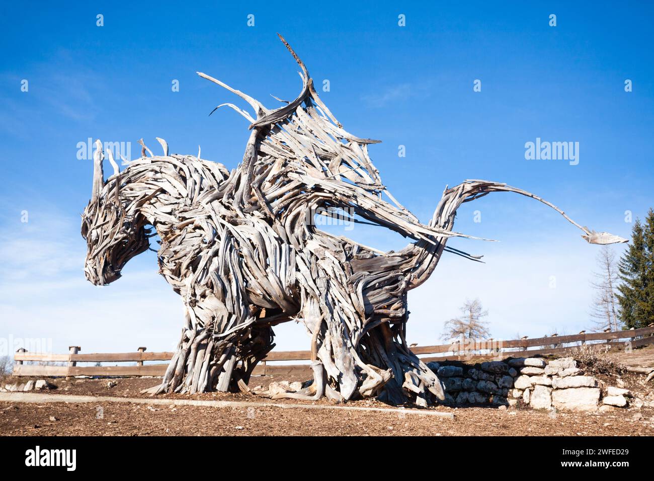 Wooden sculpture of a dragon made of tree branches. Vaia tempest dragon ...
