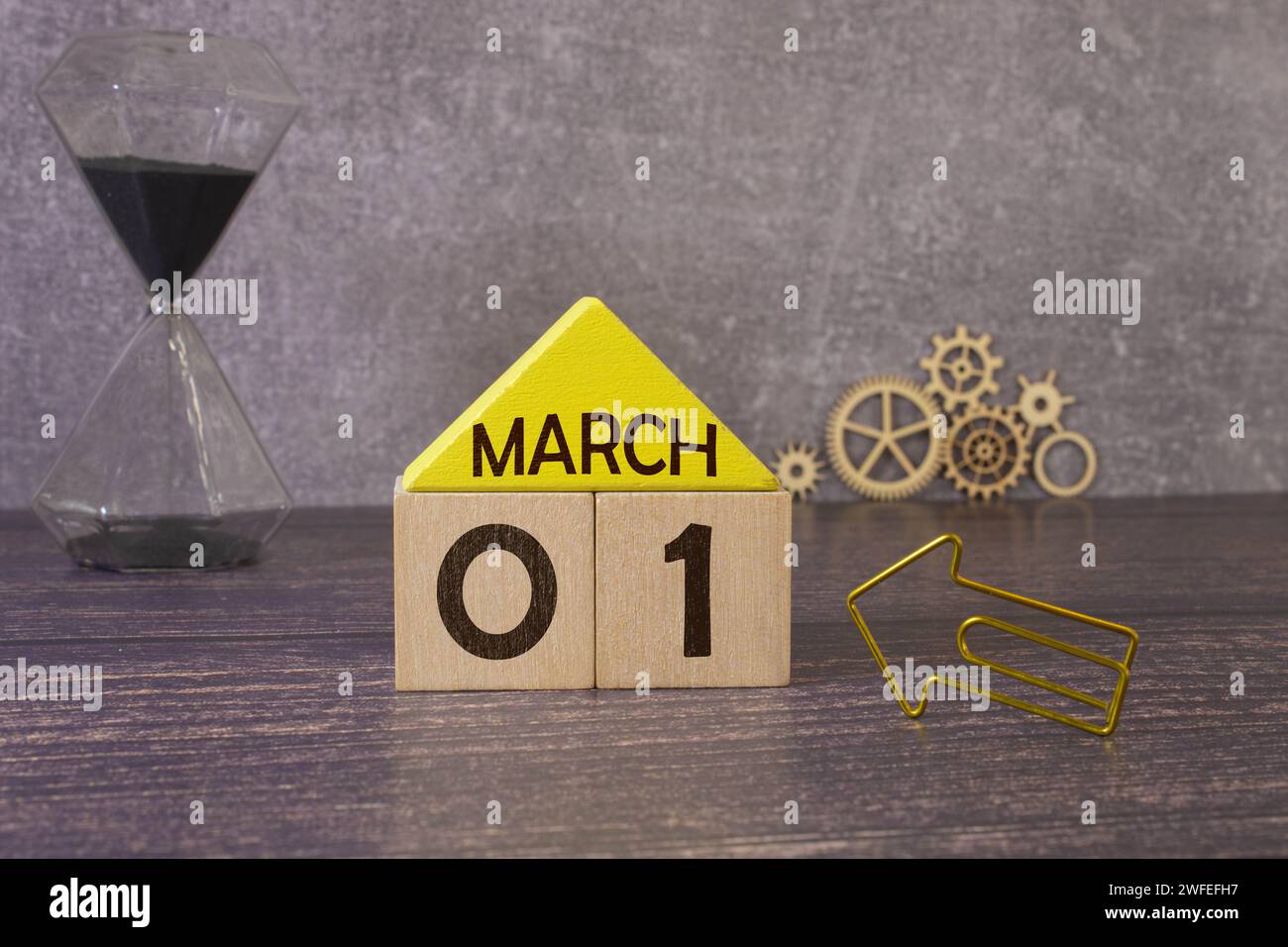 March 1 calendar date text on wooden blocks with blurred park ...