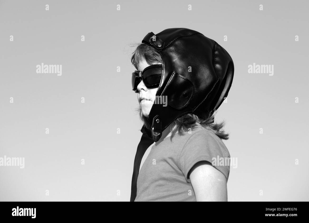 Portrait of little boy with pilot helmet and glasses. Concept of kids ...