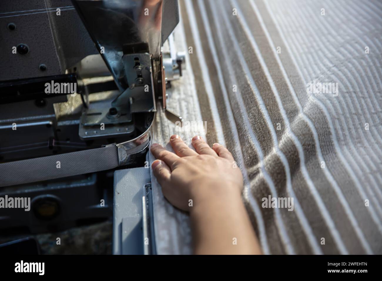 Threading an industrial sewing machine hi-res stock photography and ...