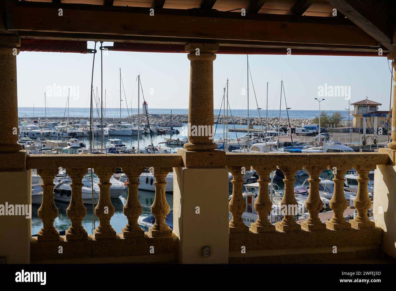view on the harbor with the fishing boats from the stone balcony on the ...
