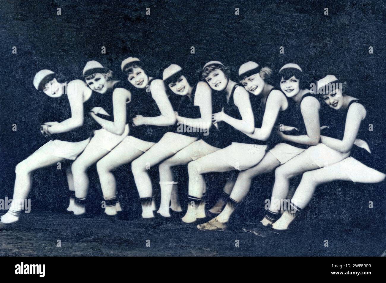 Antique photograph of 8 young women wearing the same gym outfits, circa ...