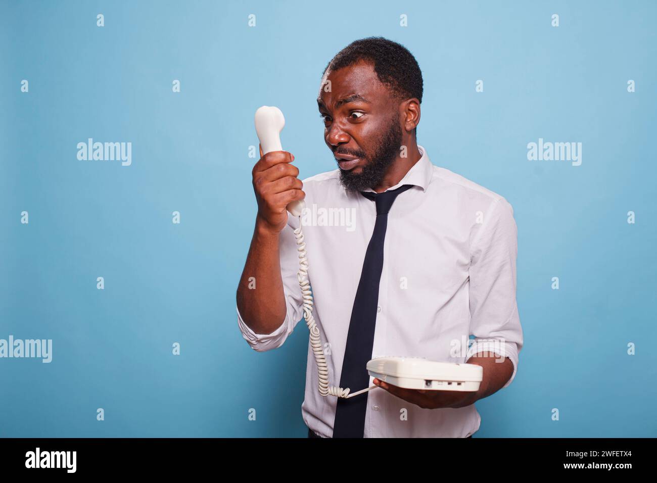 Angry yelling on landline phone hi-res stock photography and images - Alamy