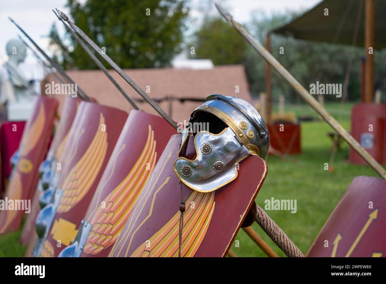 Ancient Roman legionary helmet on a red legionary shield Stock Photo ...