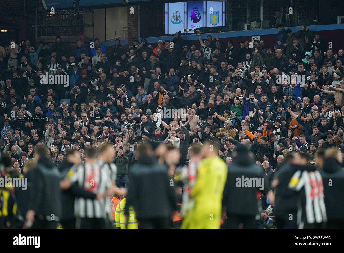 Newcastle United fans in the stands celebrate at full time after the ...
