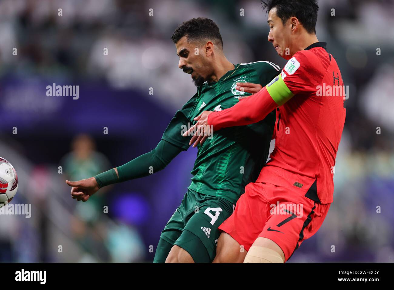 Al Rayyan, Qatar. 30th Jan, 2024. (L to R) Ali Lajami (KSA), Son Heung ...