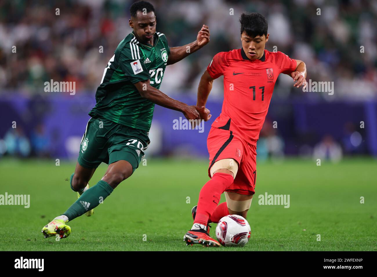 Al Rayyan, Qatar. 30th Jan, 2024. (L to R) Abdullah Radif (KSA), Hwang ...