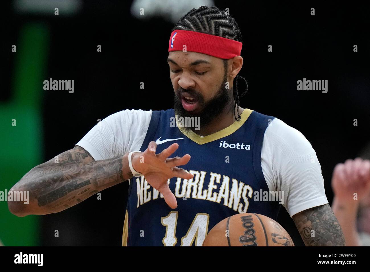 New Orleans Pelicans forward Brandon Ingram (14) looks at his hand in ...