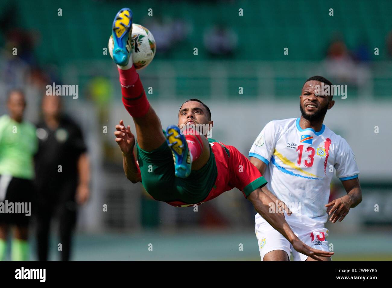 Morocco's Mohamed Chibi, left, jumps for the ball beside DR Congo's ...