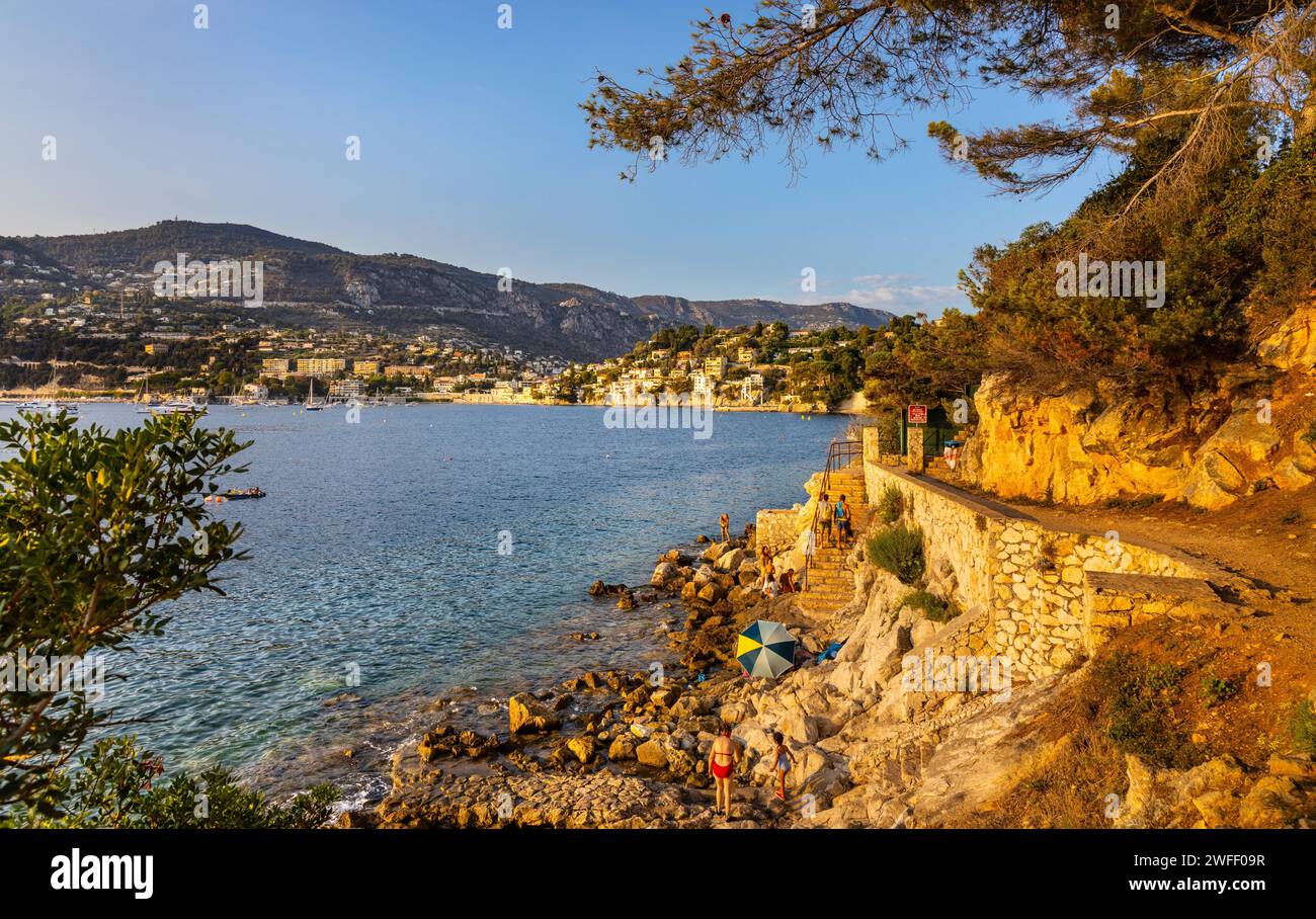 Rocky shoreline landscape of Saint-Jean-Cap-Ferrat resort town with ...