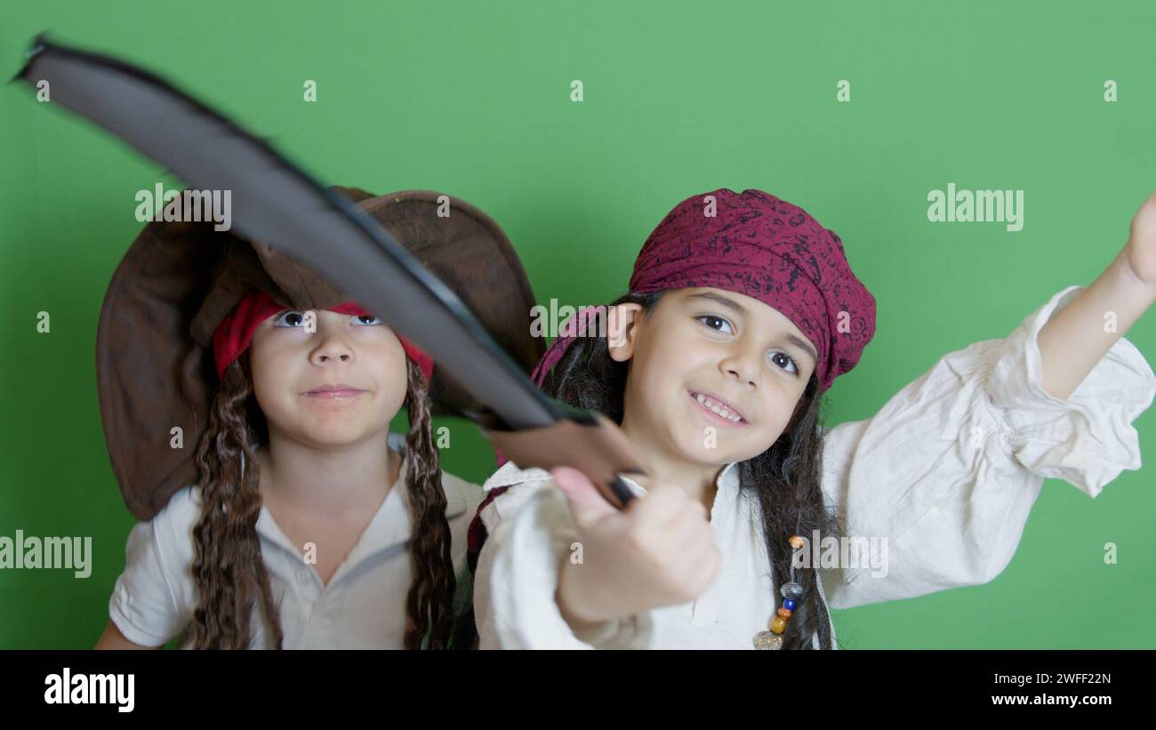 Cute children playing pirates. preschool boy making funny face ...