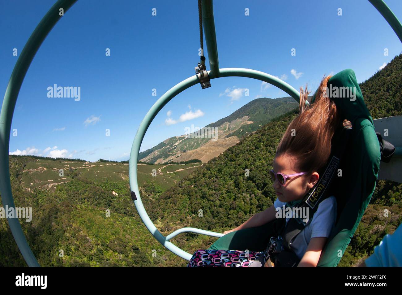 Girl with windswept hair on Skywire, Cable Bay Adventure Park, Nelson ...
