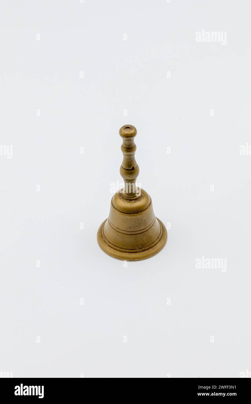 photograph of small bell for ringing use on white background Stock ...