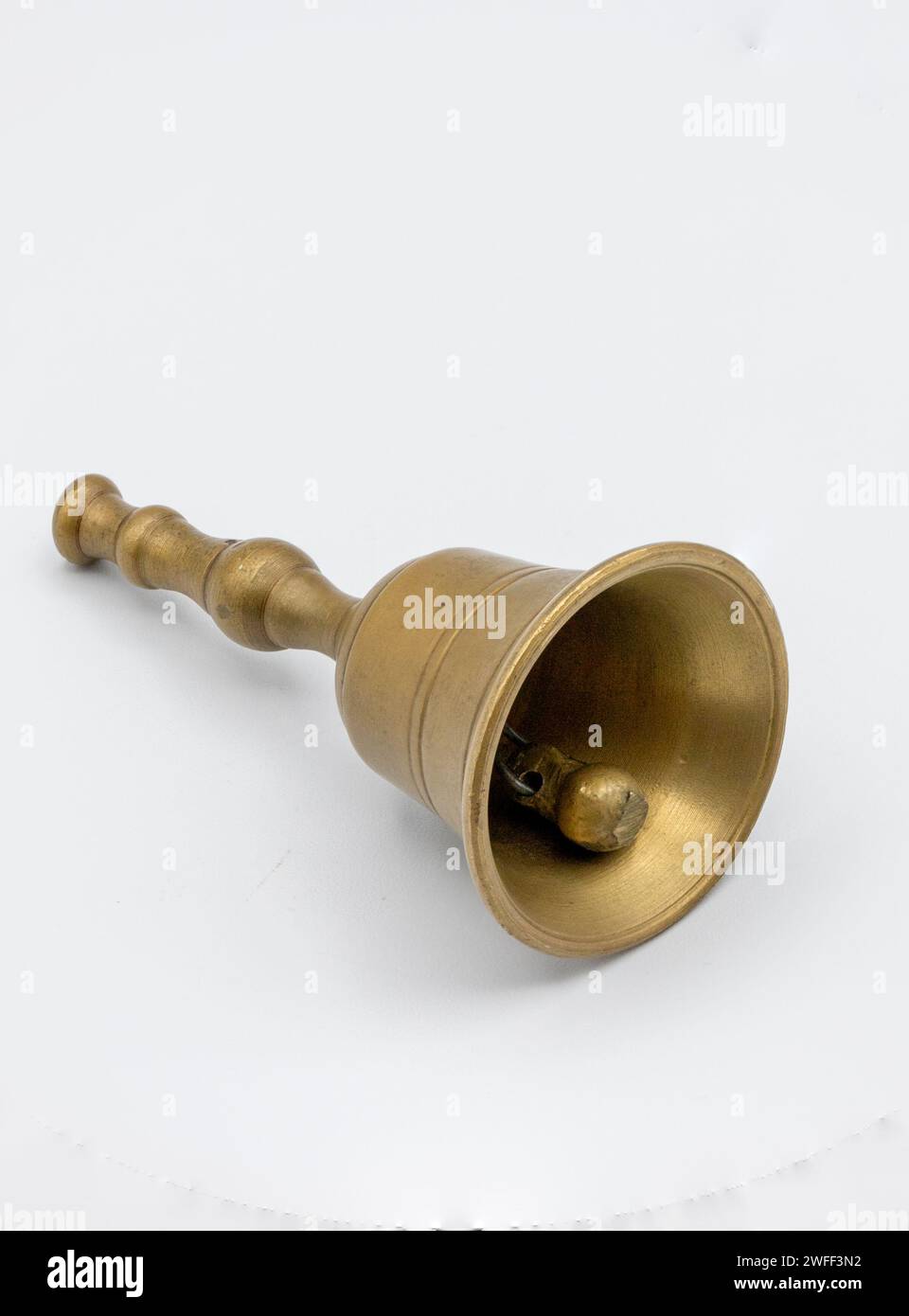 photograph of small bell for ringing use on white background Stock ...
