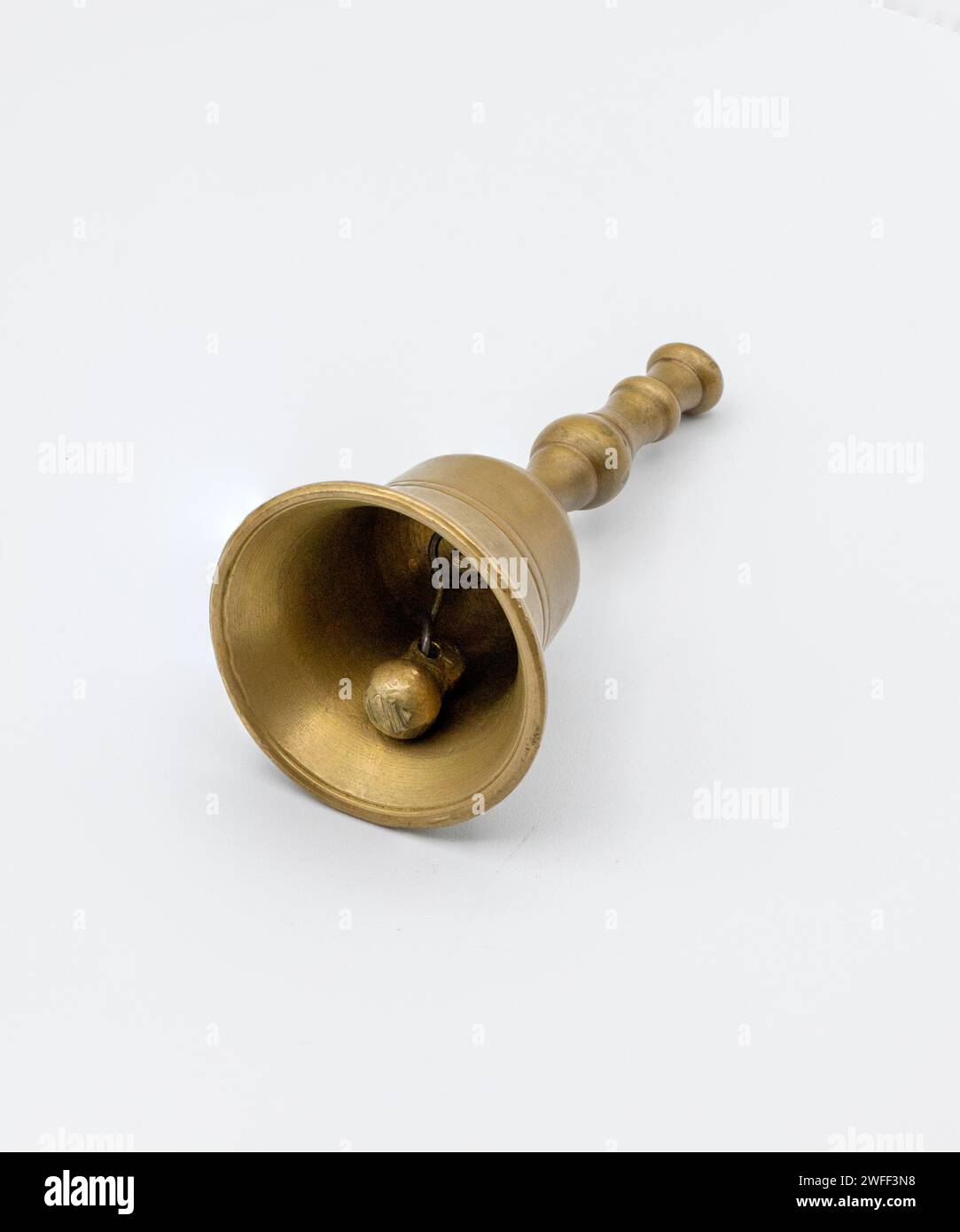 photograph of small bell for ringing use on white background Stock ...