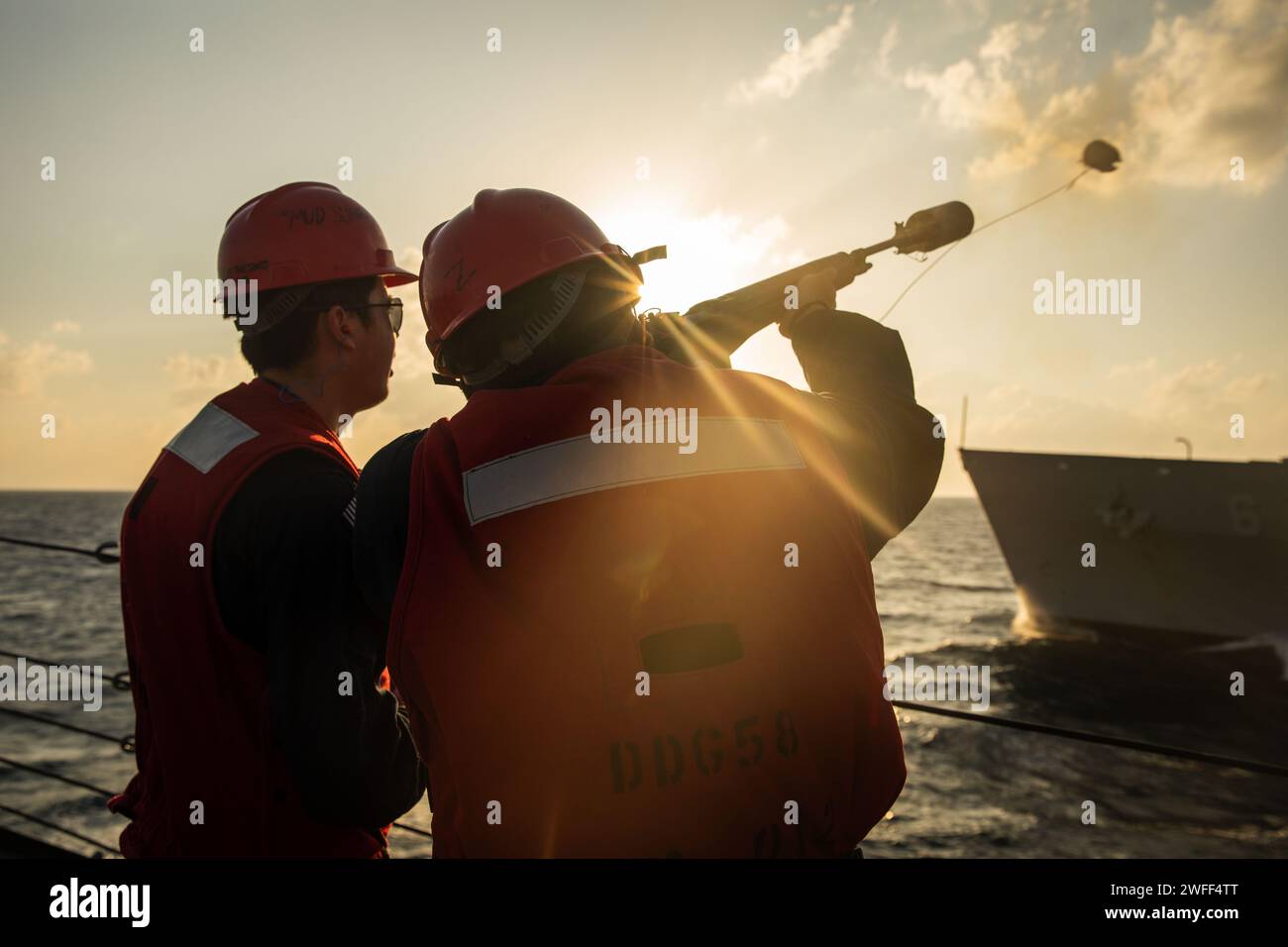 U.S. Navy Gunner’s Mate 2nd Class Benjamin Woods, left, and Gunner’s ...