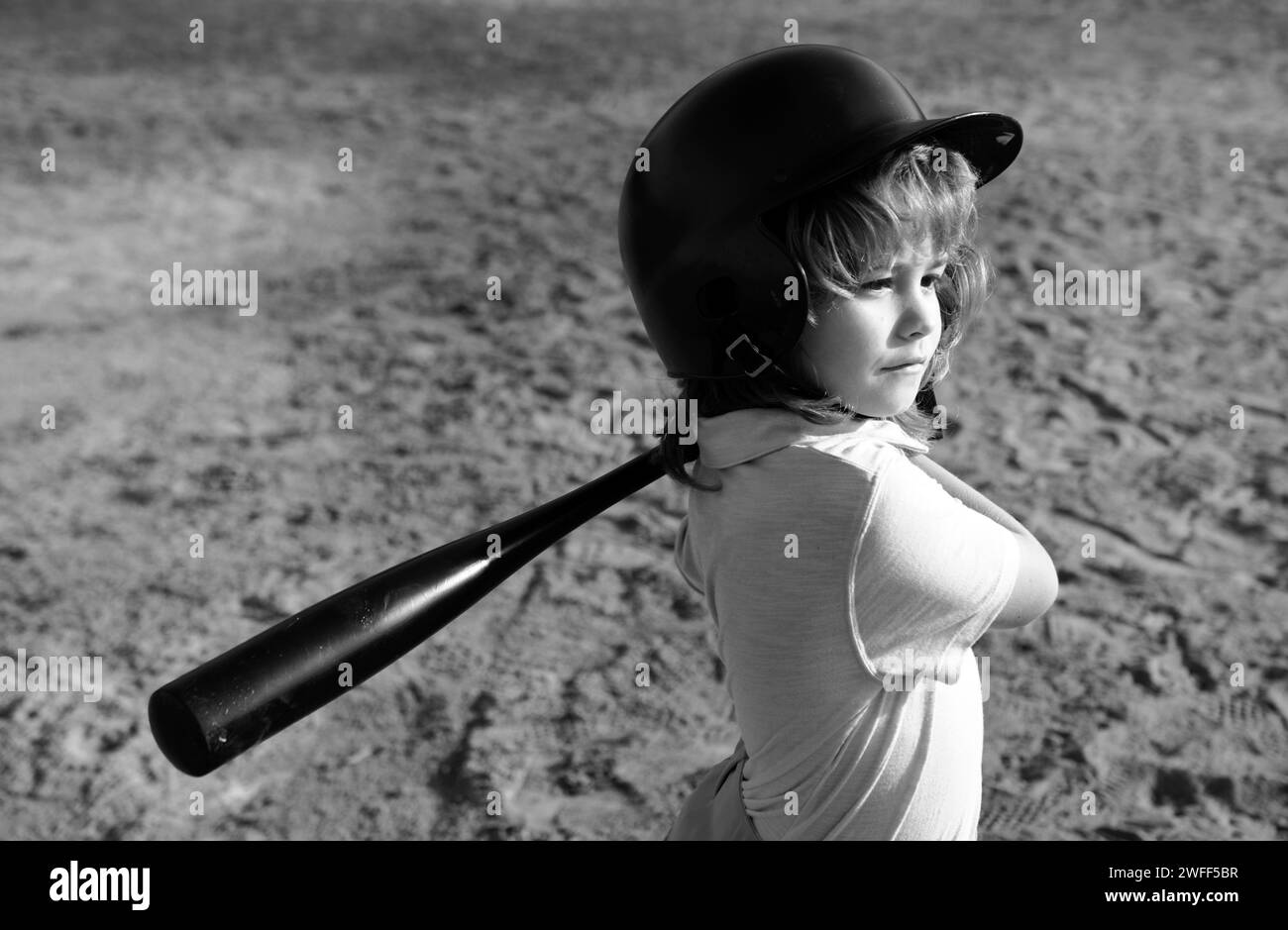 Child baseball player focused ready to bat. Kid holding a baseball bat ...